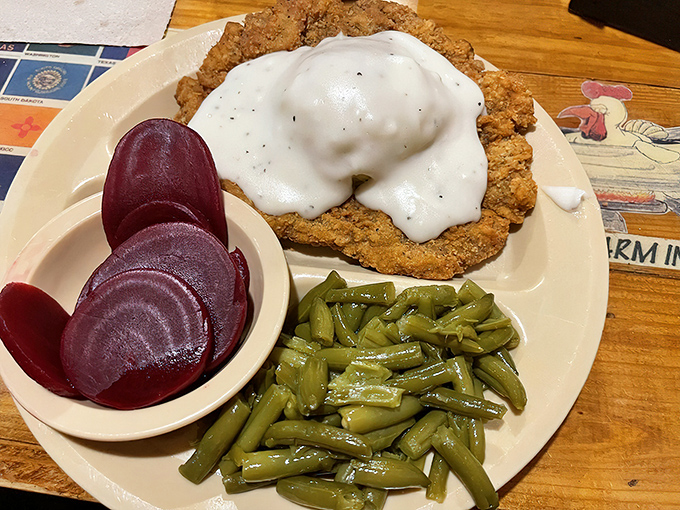 This chicken fried steak, smothered in country gravy alongside green beans and pickled beets, is what diet cheat days were invented for.