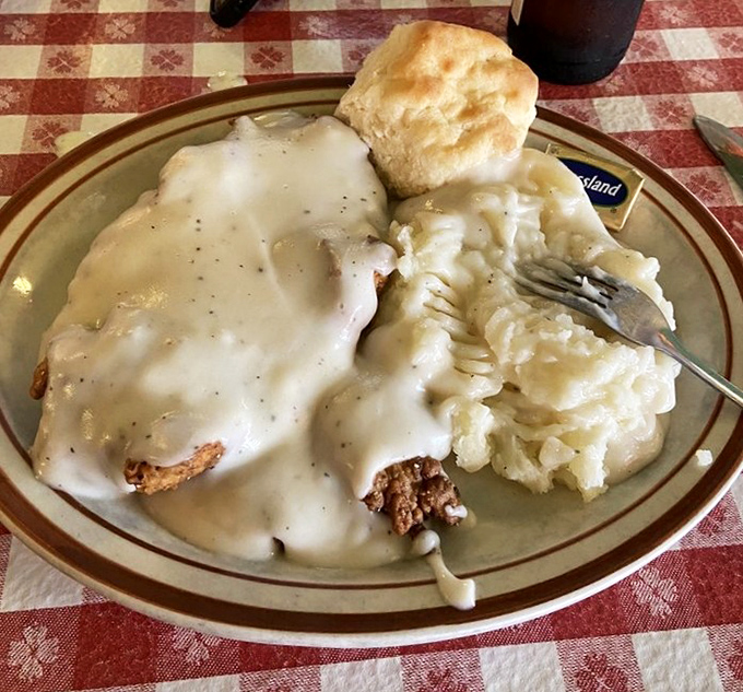 Chicken fried steak swimming in cream gravy with mashed potatoes&mdash;a plate that answers the question, "What does Texas taste like?"