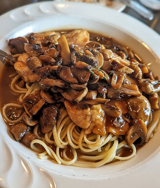 The Chicken Marsala whispers sweet nothings to mushroom lovers. That rich, glossy sauce has clearly been simmering since before your morning alarm went off.