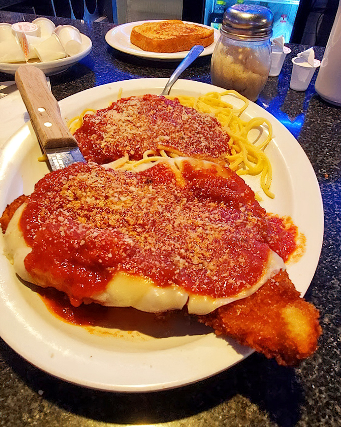 Chicken Parmesan that doesn't mess around &ndash; crispy cutlets swimming in marinara and melted cheese atop a bed of spaghetti.