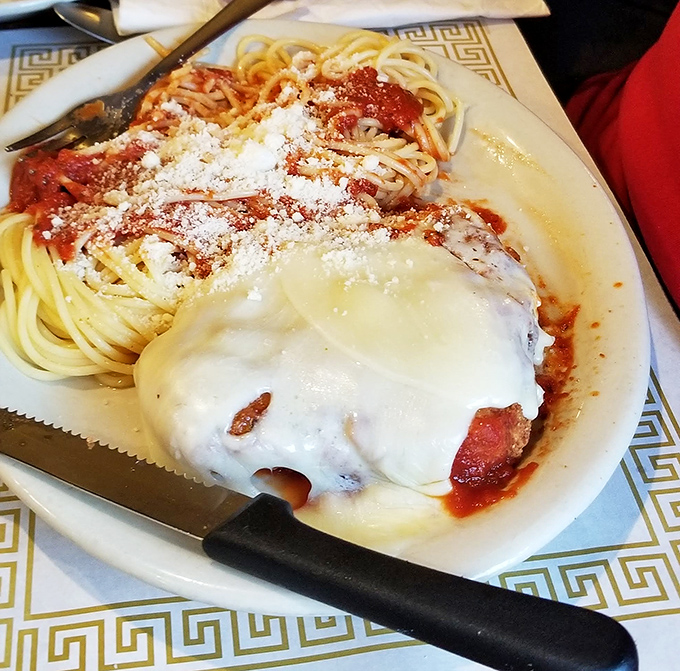 Chicken Parmesan that doesn't hide behind fancy plating &ndash; just honest-to-goodness Italian-American comfort draped in melted cheese and marinara glory.