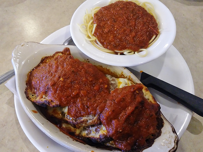Chicken Parmesan that would make any Italian grandmother nod in approval, with a side of pasta that's clearly not an afterthought. Red sauce redemption at its finest.