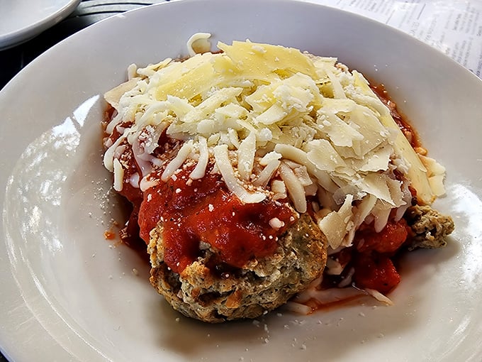 This isn't just chicken parmesan; it's a masterclass in Italian-American comfort. The generous blanket of cheese tells you someone in that kitchen really cares.