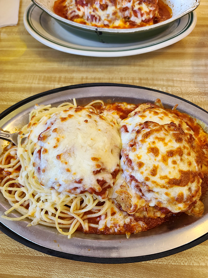 Chicken Parmesan that would make any Italian grandmother nod in approval&mdash;crispy, cheesy, and nestled on a bed of spaghetti. 