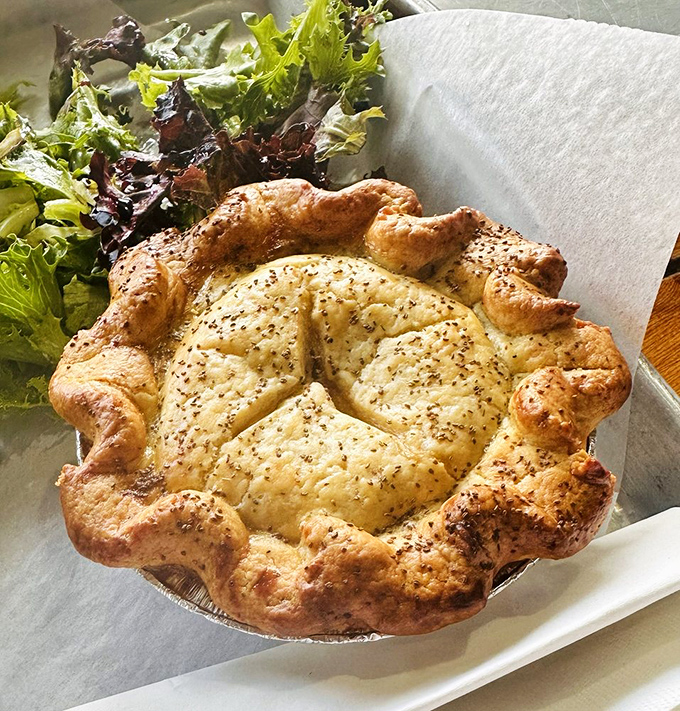 This isn't just a chicken pot pie; it's comfort wrapped in pastry, a flaky fortress protecting a kingdom of savory goodness.