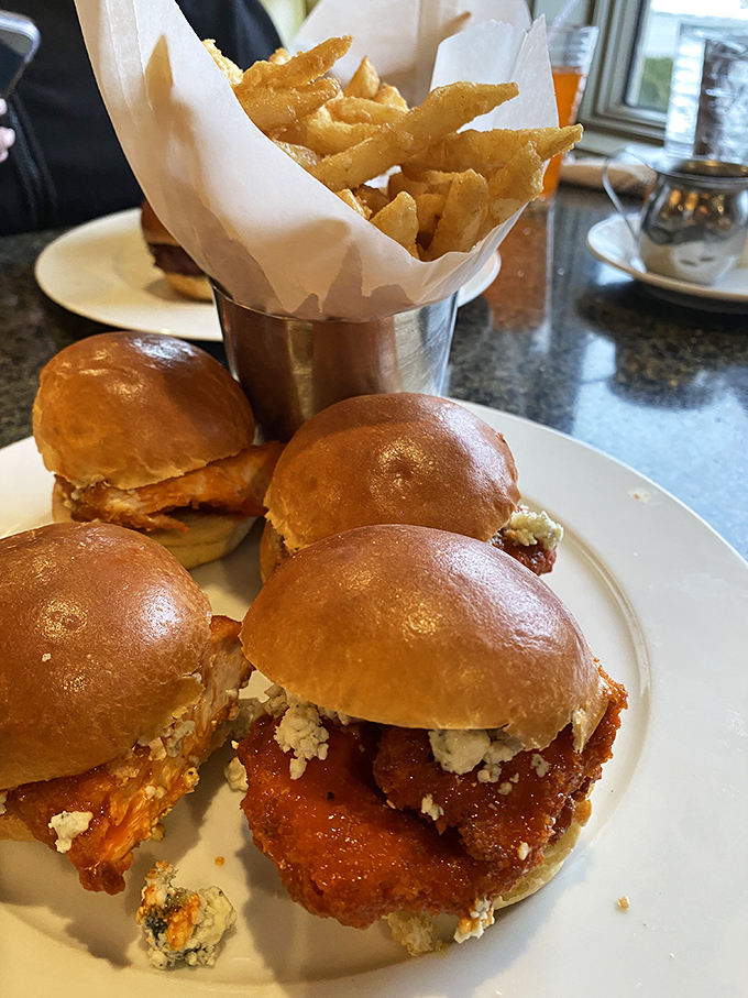 These sliders aren't messing around - crispy chicken nestled in pillowy buns with a tower of fries standing guard.