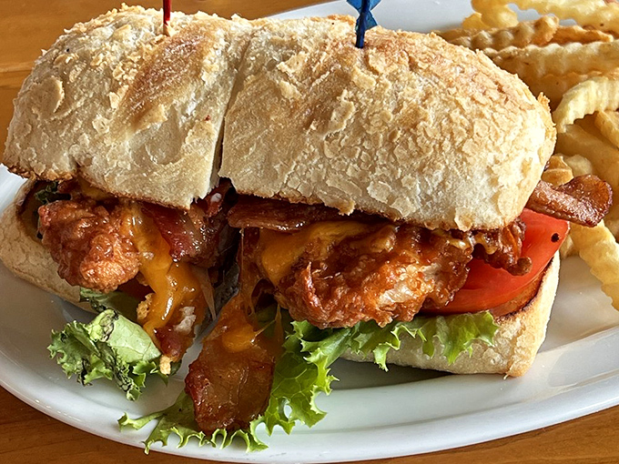 The chicken sandwich arrives like a savory skyscraper of crispy, juicy perfection. Those crinkle-cut fries aren't just sidekicks&mdash;they're co-stars.