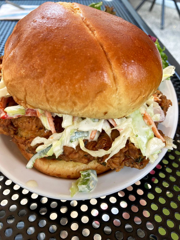 The chicken sandwich that launched a thousand road trips. That golden bun cradles crispy buttermilk fried chicken like it's holding the crown jewels.