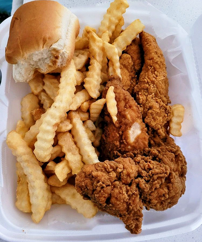 Crinkle-cut fries and chicken that would make Colonel Sanders weep with envy. The roll isn't just a garnish&mdash;it's there to soak up every last bit of flavor.