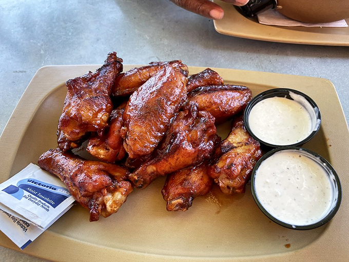 Wings so glossy they could star in a shampoo commercial, minus the hair and plus the napkin avalanche.