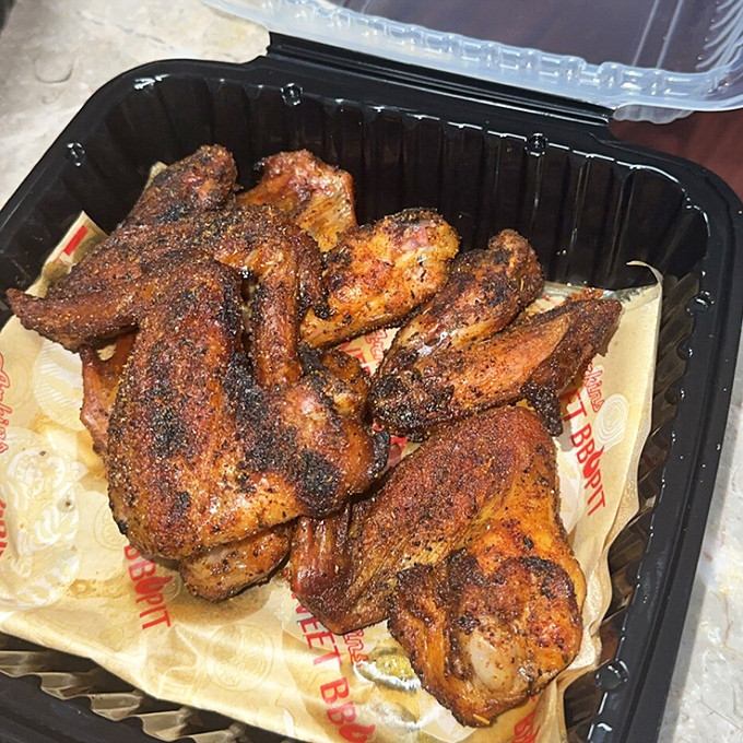 Wings with a smoke ring so perfect they could be framed in a museum. The spice-crusted skin promises a flavor explosion that delivers on every bite.