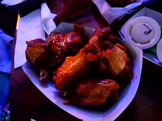 These wings aren't trying to win beauty contests; they're too busy delivering that perfect balance of crispy skin, tender meat, and saucy goodness.