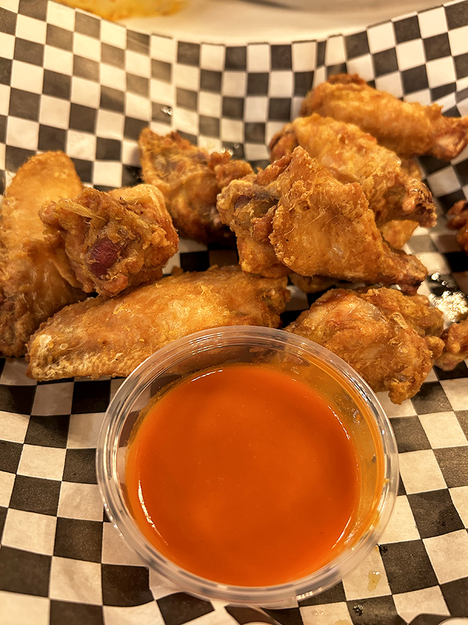 These aren't just wings; they're golden-fried proof that Crab & Shell knows their way around the fryer as well as the steamer.