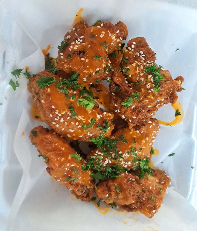 These aren't just wings; they're crispy vessels for that sticky-sweet-spicy sauce that'll have you licking your fingers with zero shame.