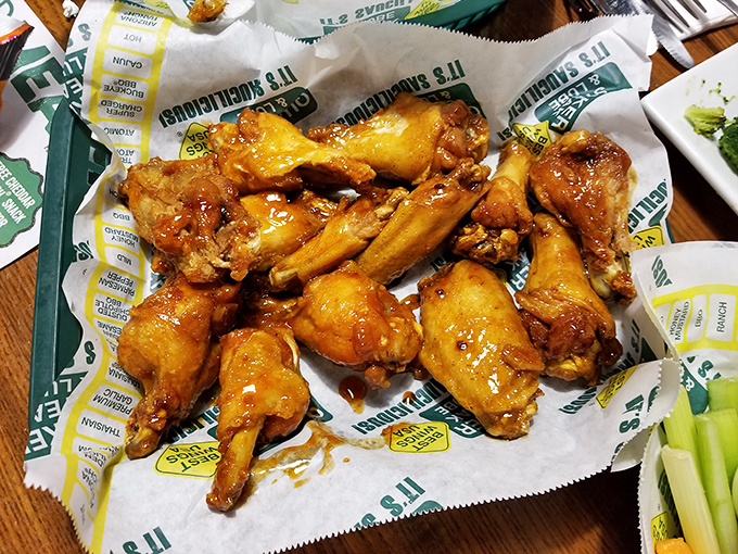 These wings aren't just coated in sauce—they're baptized in it. Each one glistening with that perfect balance of sweet, tangy, and "can I order another dozen?"