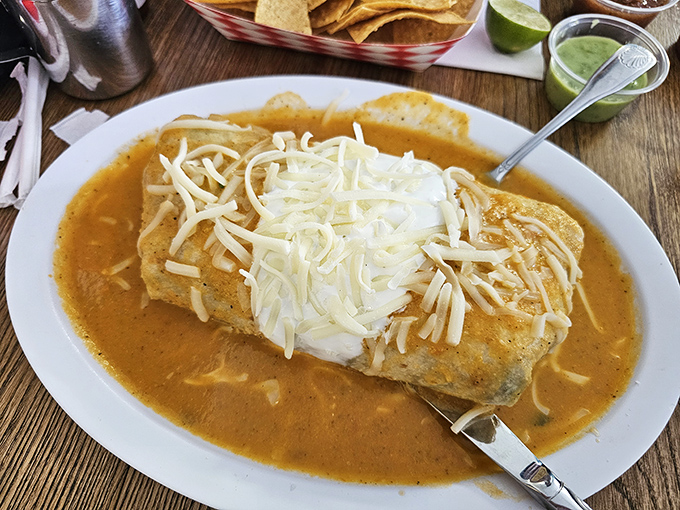 Swimming in savory sauce and blanketed with melted cheese, this burrito isn't just a meal&mdash;it's a commitment to deliciousness.