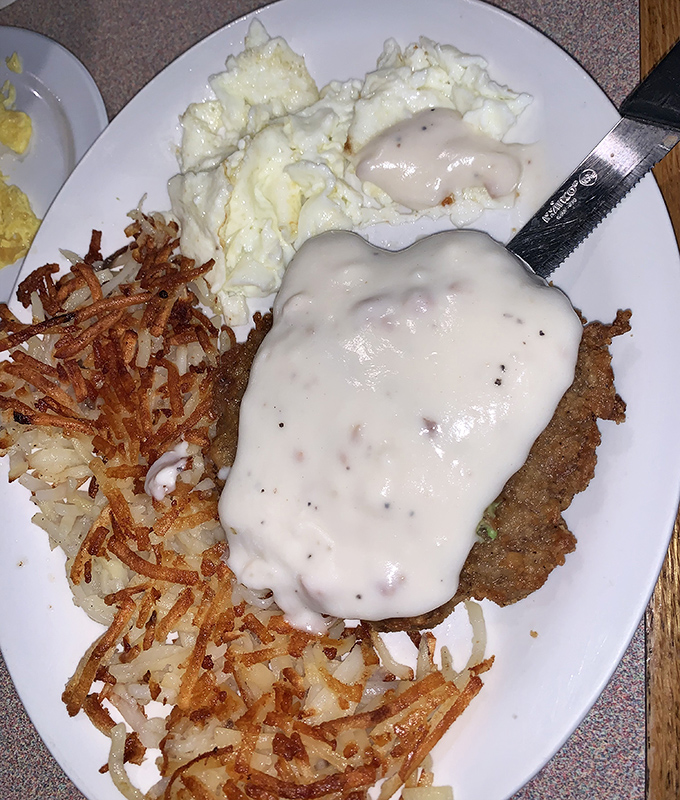 Chicken fried steak wearing a gravy overcoat with eggs and hash browns&mdash;the breakfast equivalent of winning the lottery on a Tuesday morning.