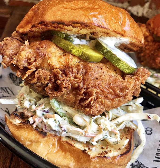 The chicken sandwich that launched a thousand cravings&mdash;crispy chicken, tangy pickles, and creamy slaw stacked on a toasted bun. Napkins required, regrets impossible.