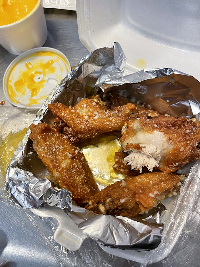 Even the wings demand attention, glistening with promise and accompanied by that universal truth: good food needs good dipping sauce. A supporting actor that steals scenes.