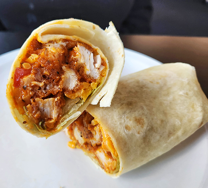 The chicken wrap at Jake's doesn't just satisfy hunger&mdash;it resolves it with authority, bundling spicy goodness into a handheld masterpiece.