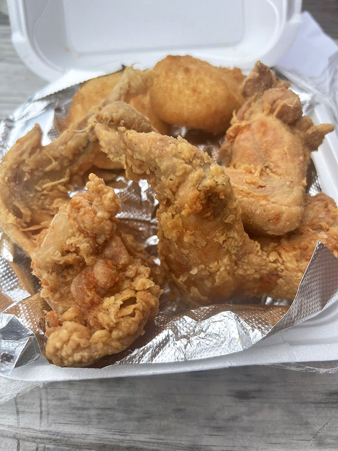 Fried chicken so perfectly golden, it deserves its own trophy case. The crunch is audible three tables away.