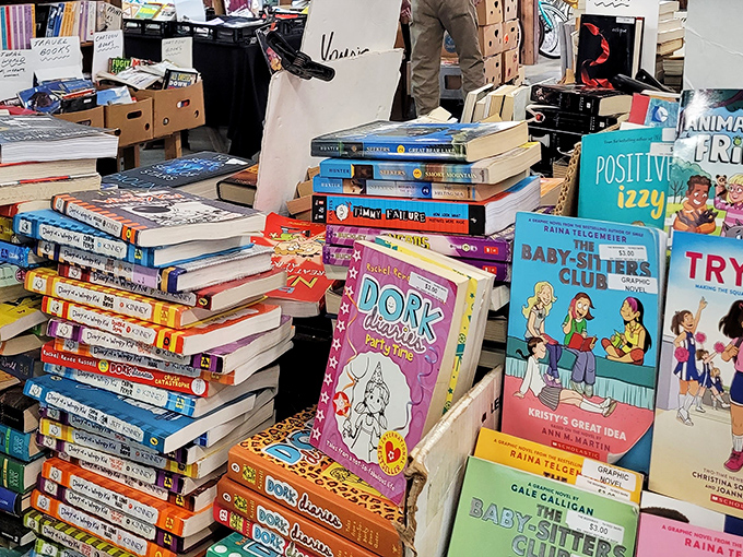 Literary paradise for young readers! This book vendor's colorful collection proves that despite what kids say, sometimes the best adventures don't require batteries or Wi-Fi.
