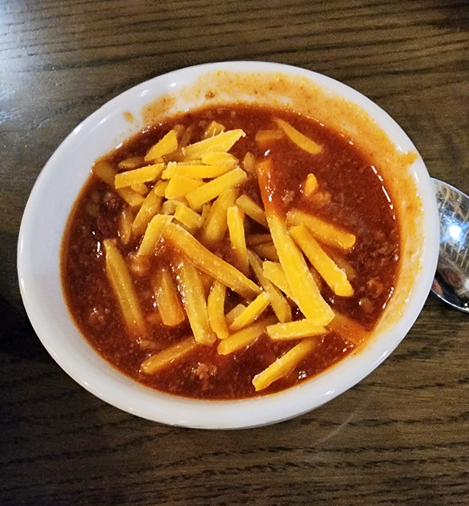 This isn't just chili &ndash; it's a hearty hug in a bowl, topped with enough cheese to make Wisconsin nervous.