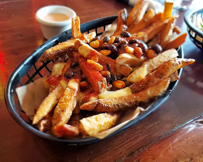 French fries living their best life under a blanket of chili, cheese, and corn. Comfort food that understands the assignment. 