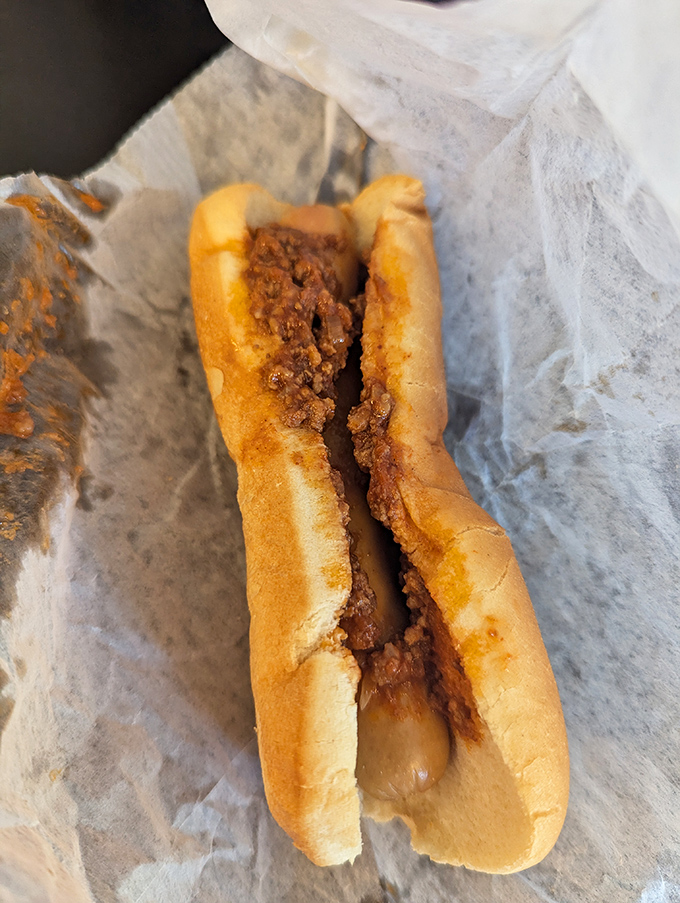 The cross-section reveals the Spanish Dog's secret&mdash;that perfectly seasoned meat sauce permeates every bite. It's not fancy, but it's the kind of honest food that creates lifelong cravings.