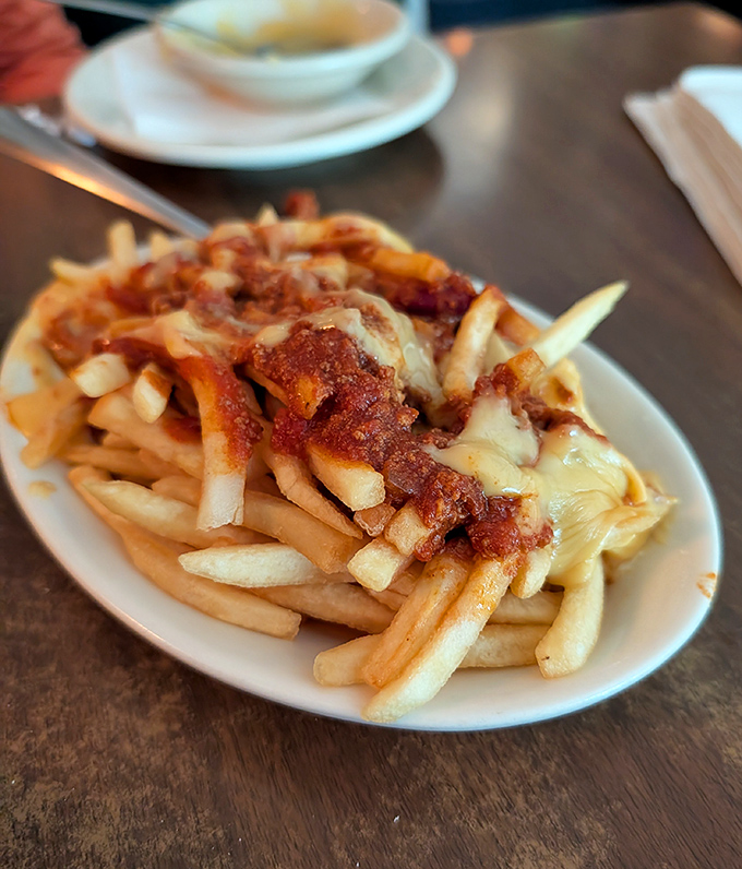 Chili cheese fries &ndash; where crispy potatoes meet savory chili in a marriage so perfect it should have its own reality show.
