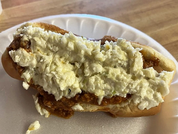 This isn't just a chili dog—it's a Southern handshake in food form, topped with enough coleslaw to make your cardiologist start pricing vacation homes.