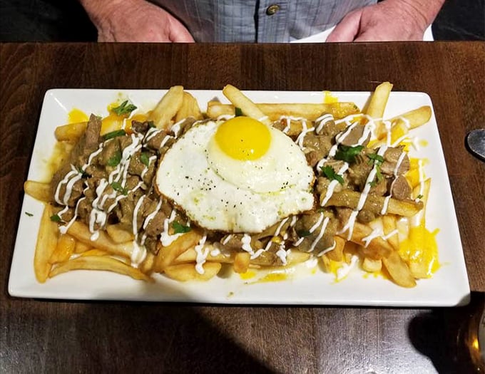 Chili verde fries topped with a sunny-side-up egg: because sometimes regular fries just aren't having enough fun.