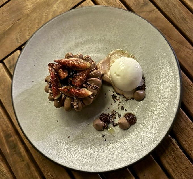 A perfect fig tart with gelato that proves simplicity is the ultimate sophistication. The kind of dessert that silences conversation.