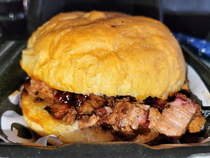 A proper brisket sandwich doesn't need fancy accessories—just a soft bun to cradle that smoky, tender meat like it's precious cargo on a delicious journey.