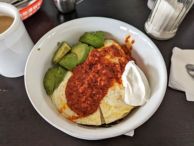 The Chorizo Bowl brings the heat with a blanket of spicy sauce, cooling sour cream, and avocado slices that California does better than anyone.