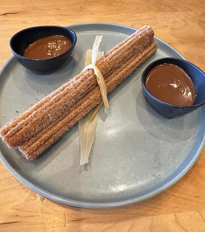 Churros done right: crispy, cinnamon-sugar coated wands of happiness served with twin pools of caramel dipping sauce. Resistance is futile.