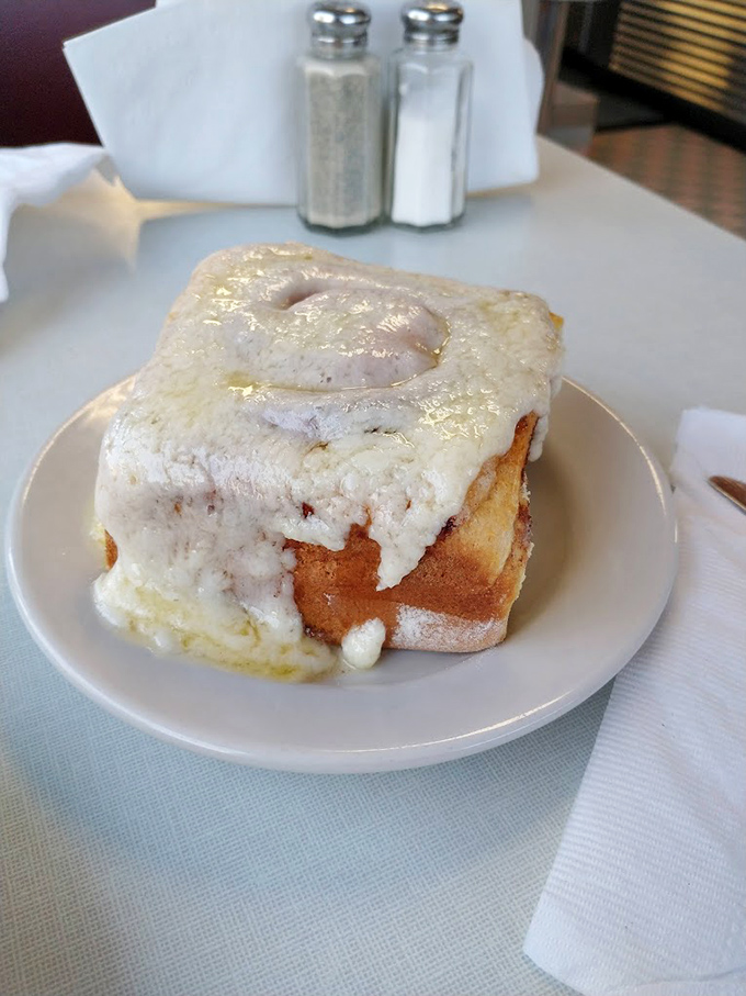 Not just a cinnamon roll&mdash;it's a fortress of frosting, a citadel of cinnamon, a monument to morning indulgence that demands to be photographed.