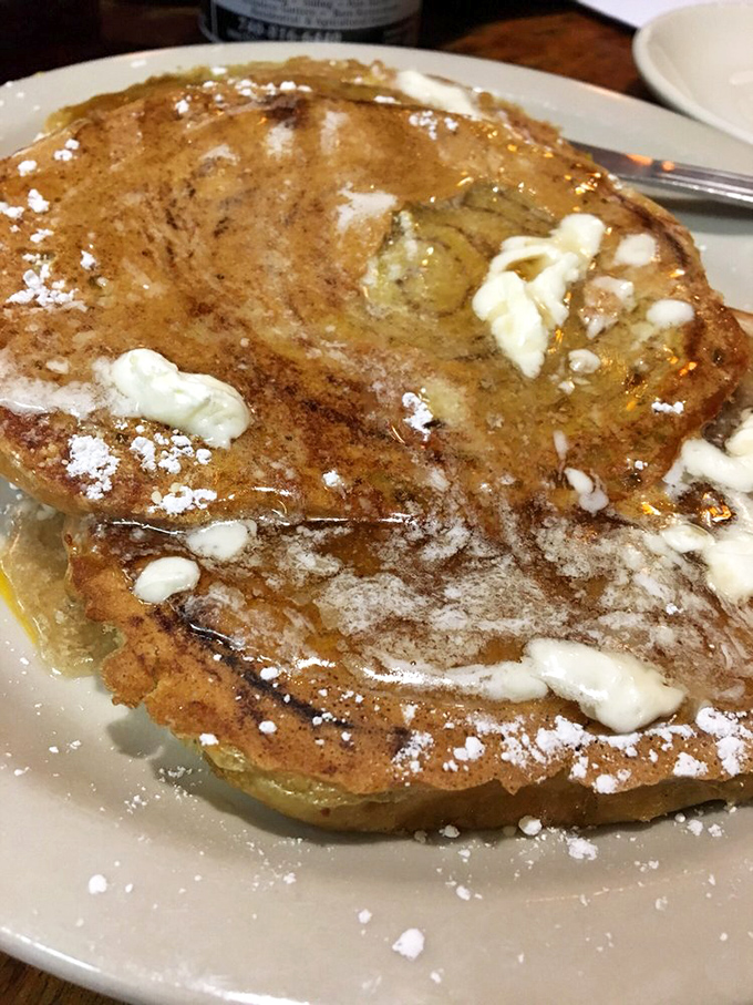 This isn't just French toast—it's a cinnamon-infused cloud that makes you question why you ever settled for regular toast in the first place.
