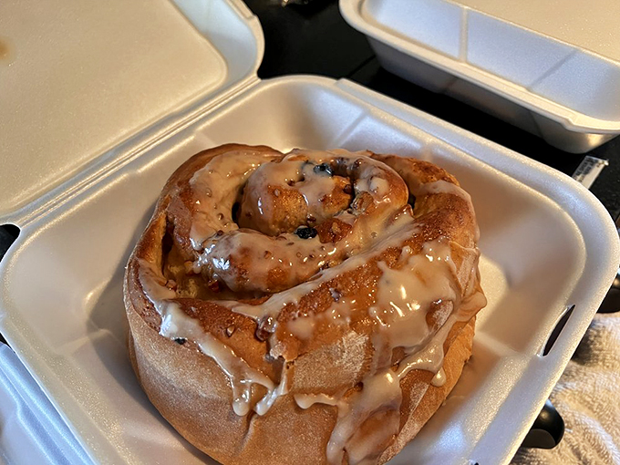 Not just a cinnamon roll, but a cinnamon revelation. The icing doesn't drip, it cascades – like a sweet waterfall of morning happiness.