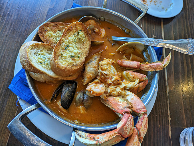 The Cioppino arrives like a seafood treasure chest that's exploded onto your plate. Those crab legs are practically waving hello!