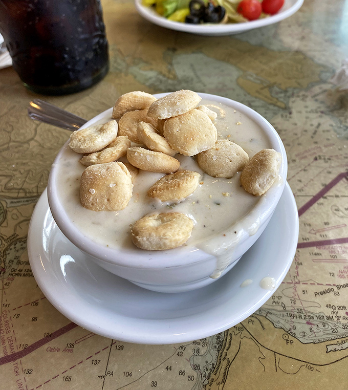 This isn't just clam chowder; it's a creamy ocean hug in a bowl, topped with oyster crackers that practically beg to dive in.