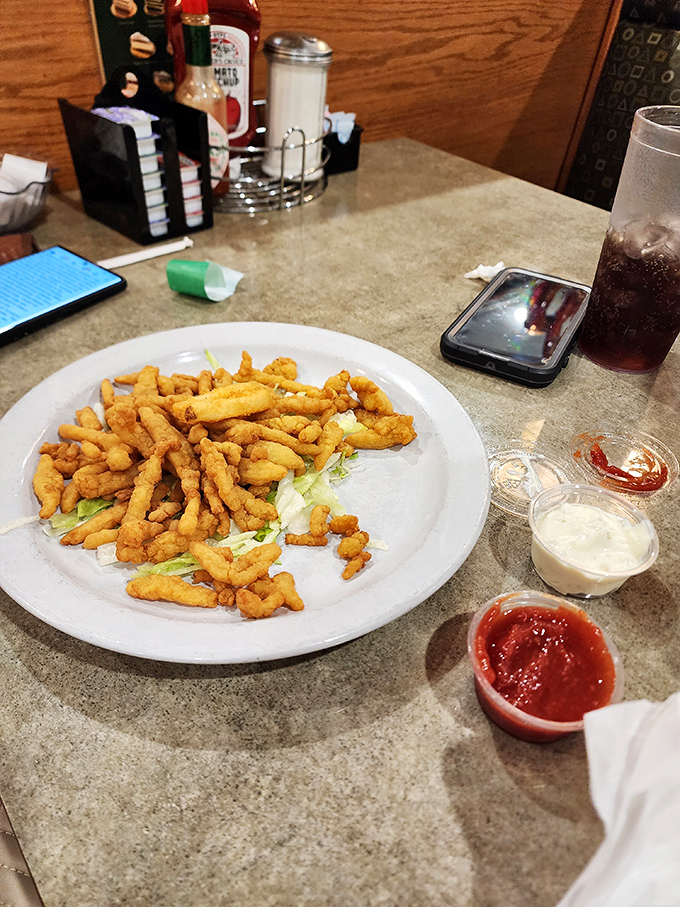 These clam strips aren't just fried &ndash; they're transformed into crunchy little wands of seafood magic that disappear faster than your diet resolutions.
