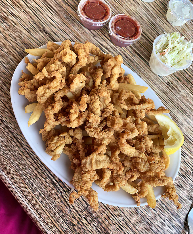 Golden-fried clam strips piled high—proof that sometimes the simplest pleasures are worth traveling for.