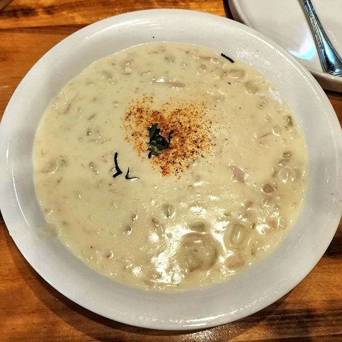 Clam chowder so creamy and comforting it could end family feuds. Each spoonful delivers little treasures from the deep in a velvety embrace.