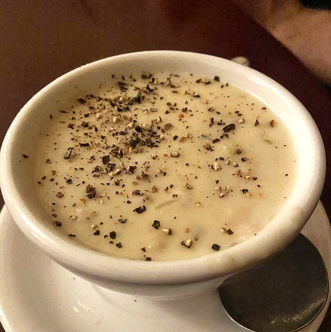 This isn't just clam chowder&mdash;it's a creamy canvas of comfort, waiting for that final artistic touch of freshly cracked pepper.