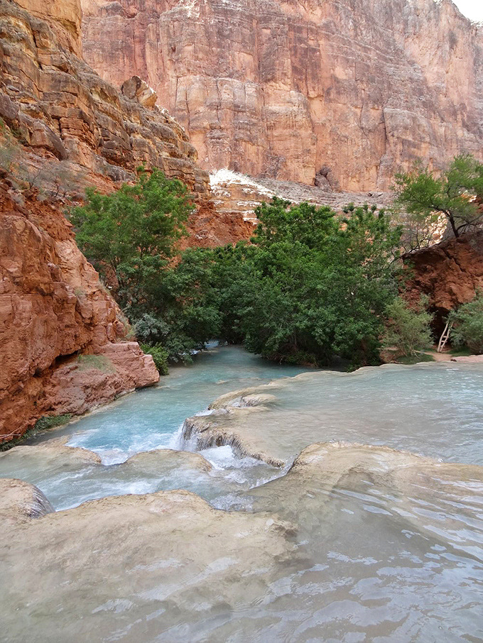 Crystal-clear pools create natural infinity edges that would make any resort designer weep with envy.