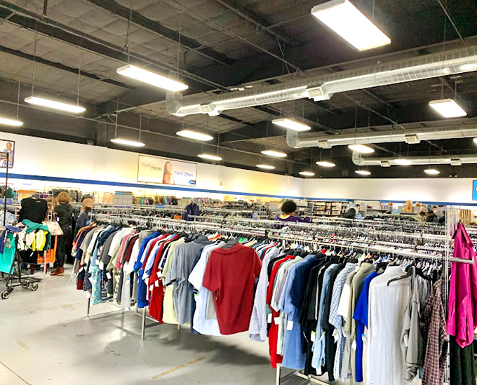 The clothing section stretches toward retail infinity. Like a fashionable Field of Dreams: if they donate it, you will come.