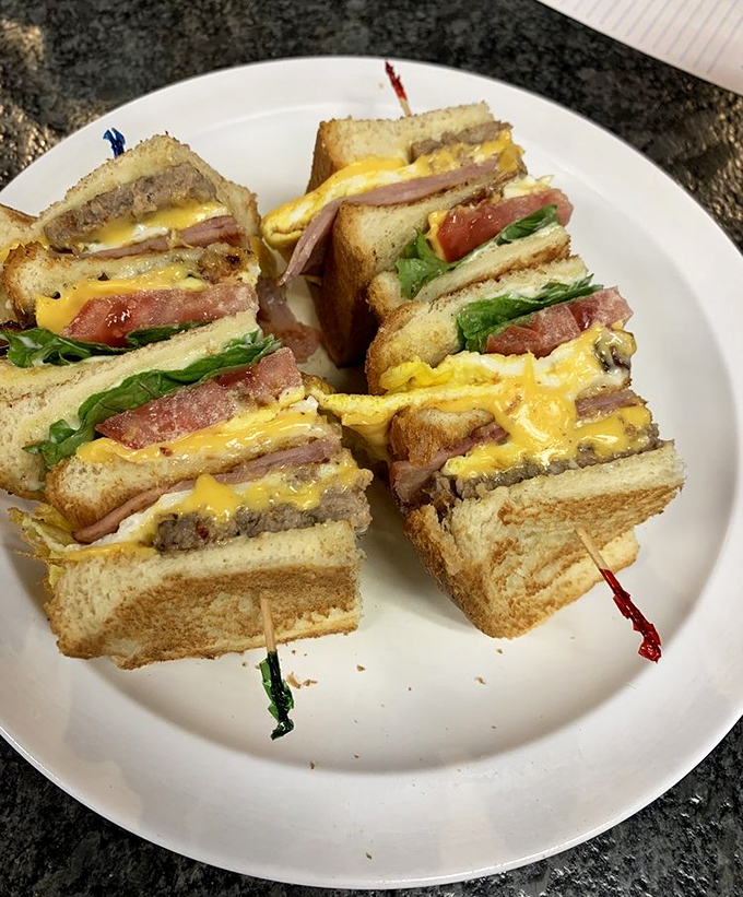 This club sandwich proves Moore Street Cafe doesn't quit after breakfast – stacked high and skewered for structural integrity.