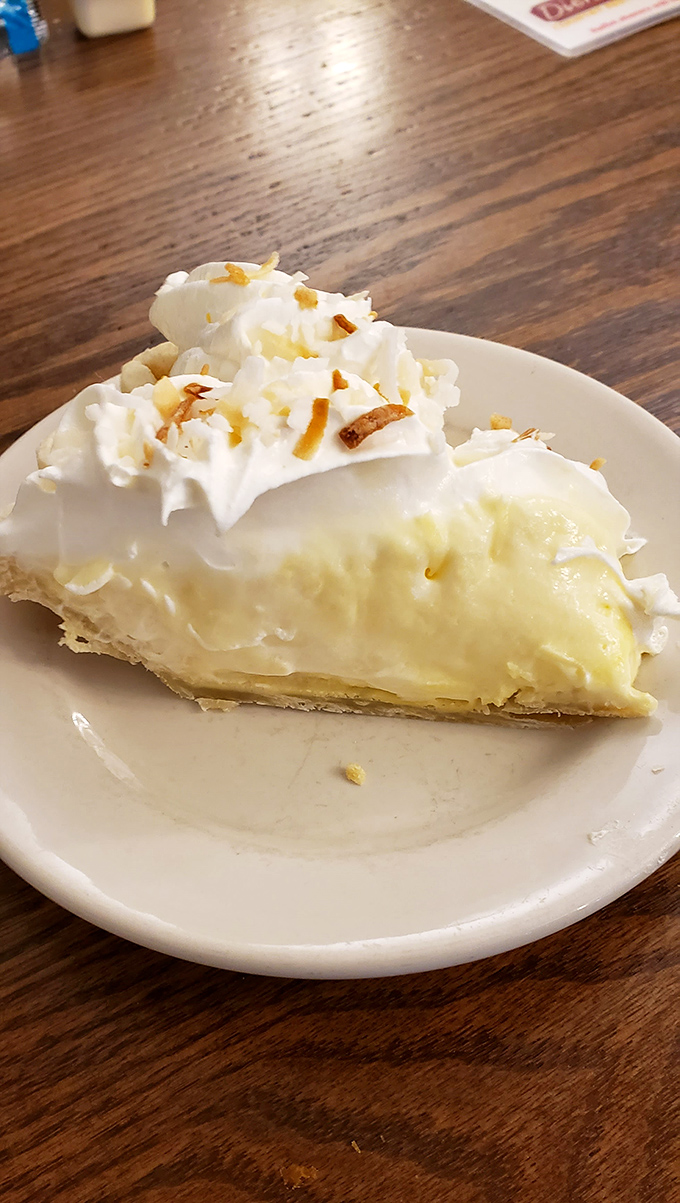 Coconut cream pie that would make your grandmother both proud and jealous &ndash; cloud-like filling topped with whipped cream and toasted coconut confetti.