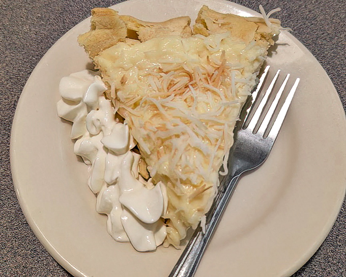 Coconut cream pie that would make your grandmother both proud and jealous. The whipped cream isn't just a topping&mdash;it's the cloud this slice floated in on.
